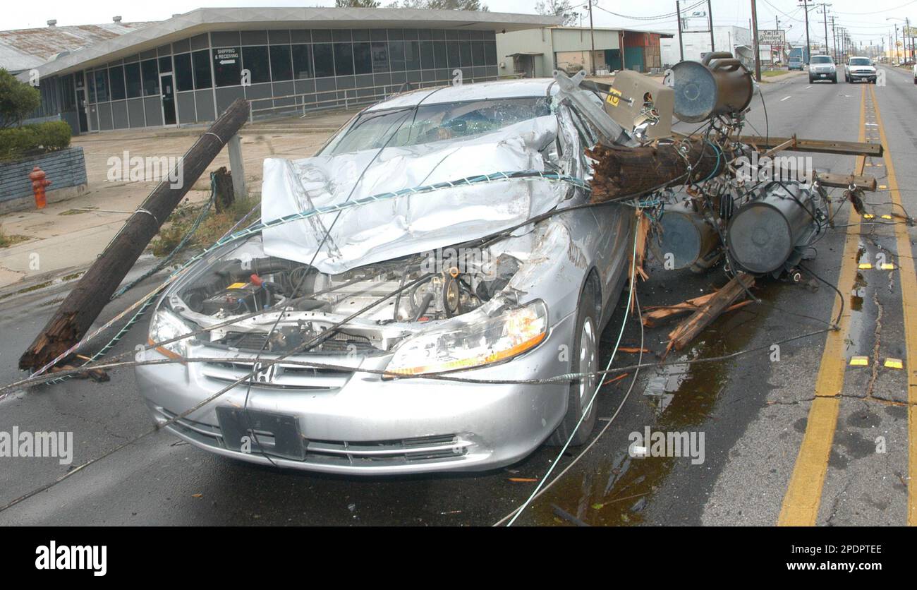A heavily damaged car sits on Broad Street, Monday, Sept. 26, 2005, in ...