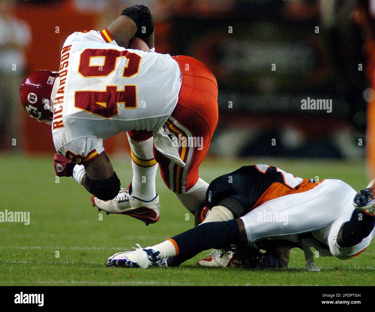 Kansas City Chiefs Tony Richardson (49) is tripped up by Denver Broncos ...