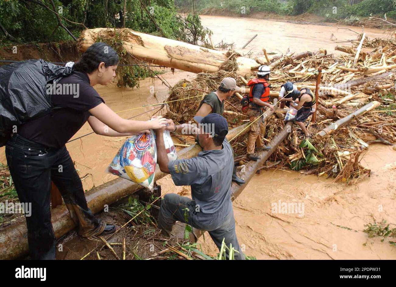 Costa Rican Red Cross workers deliver food to victims of floods near El ...