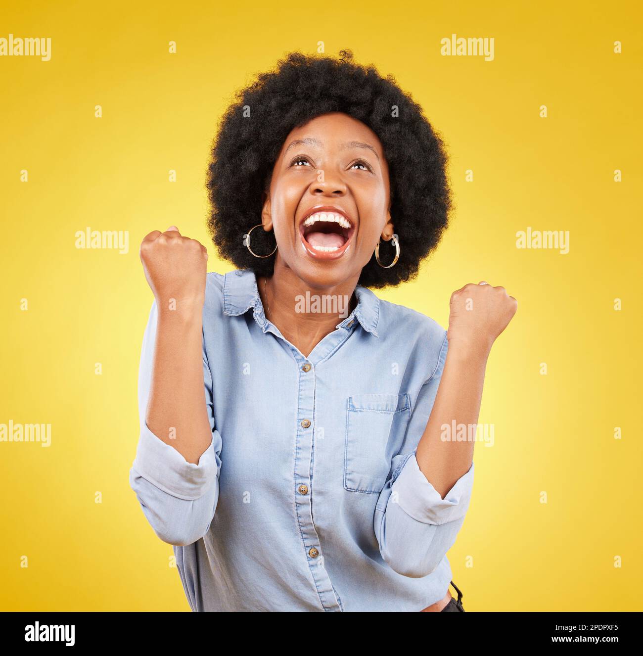 Black woman, excited face and celebrate win in studio while happy on ...