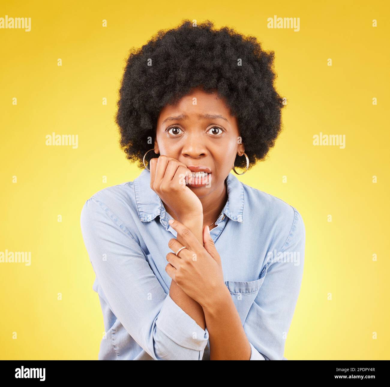 Fear, anxiety and biting nails with portrait of black woman in studio ...
