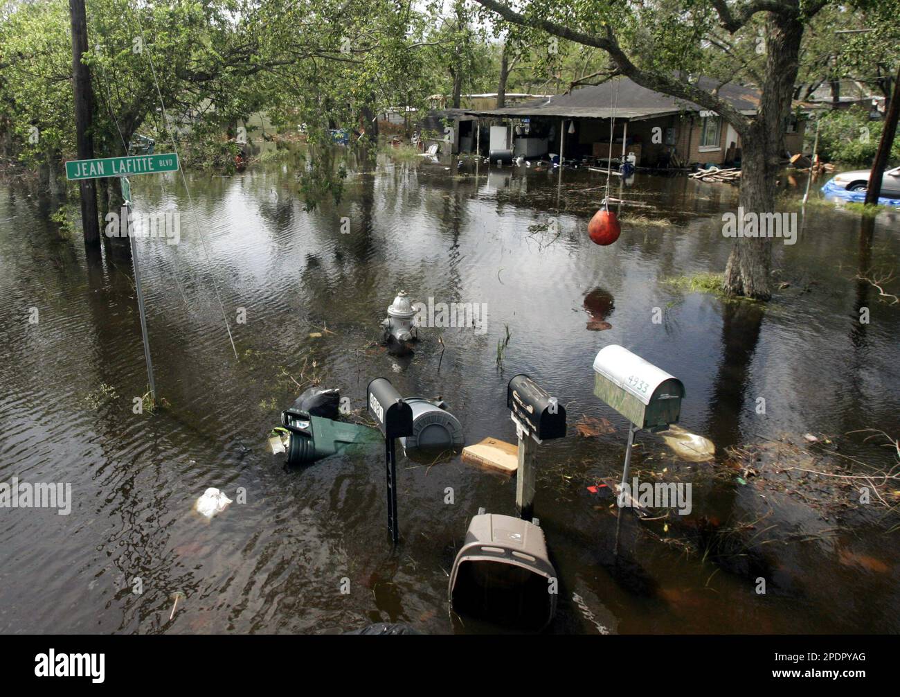 A neighborhood in Jean Laffite, La., is heavily flooded after surges ...