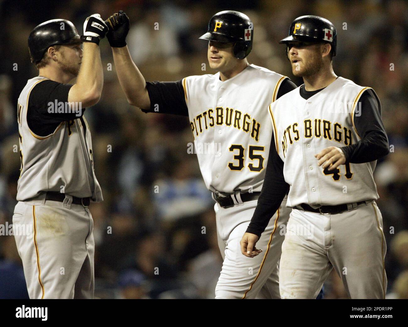 Pittsburgh Pirates' Brad Eldred, center, is congratulated by teammate ...