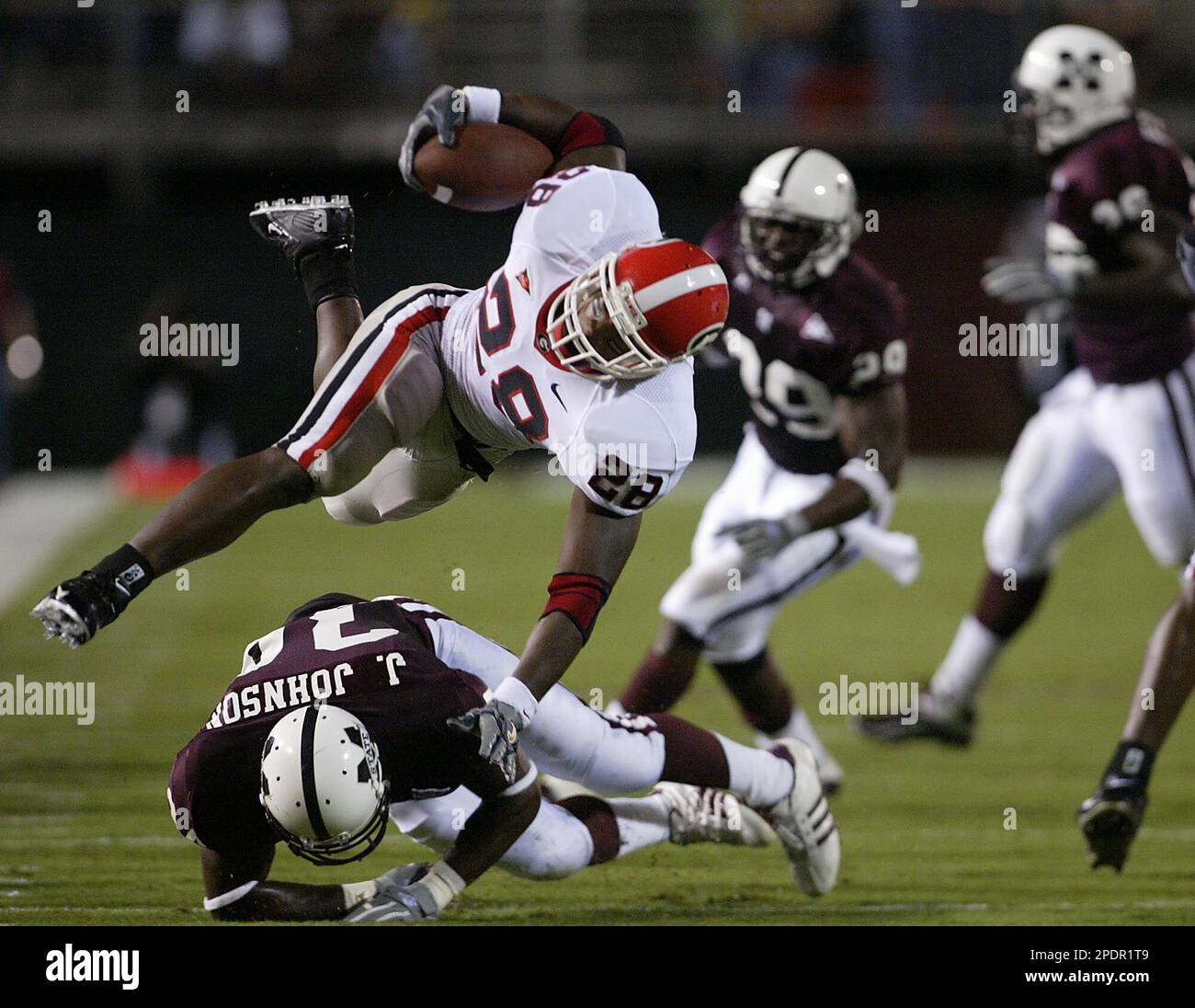 Georgia running back Danny Ware (28) dives over Mississippi State ...