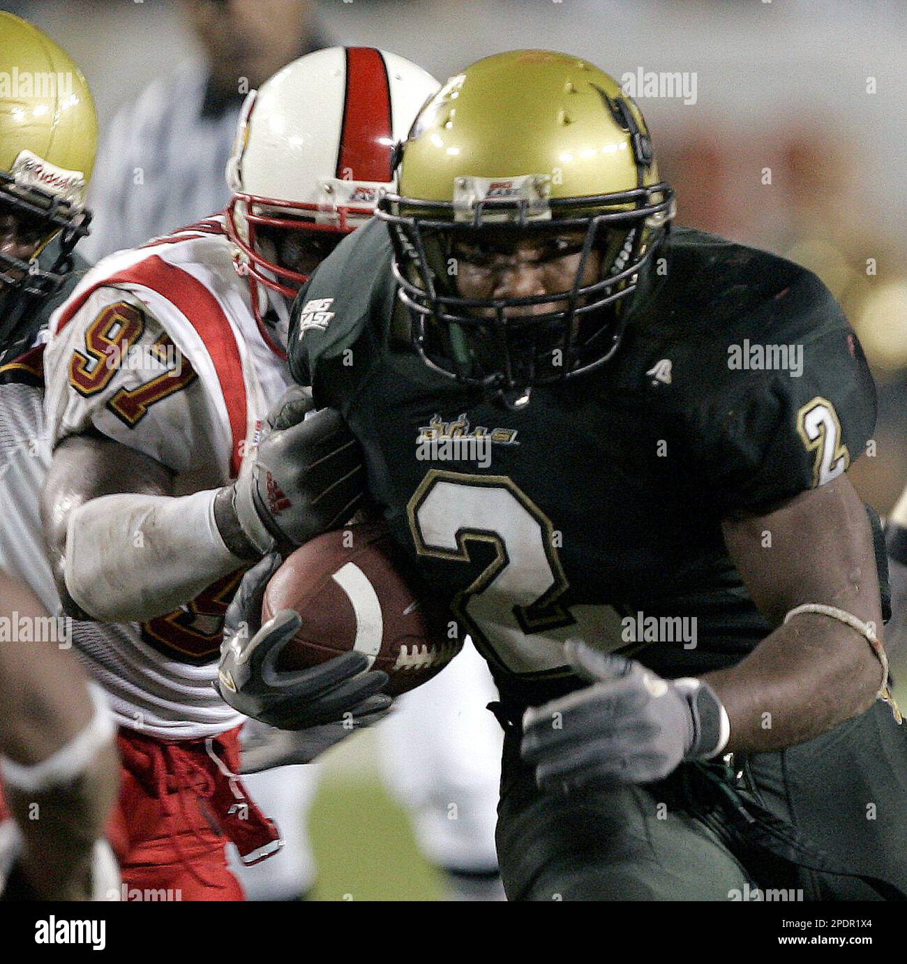 South Florida running back Andre Hall (2) gets by Louisville's Brandon ...
