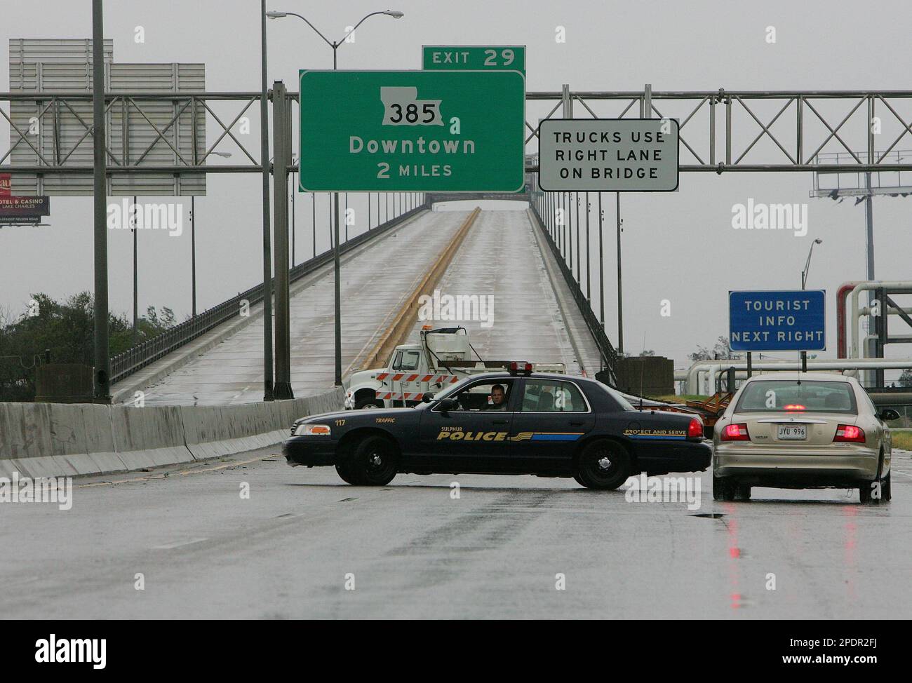 Police cruisers block off the closed I-10 bridge over Lake Charles ...