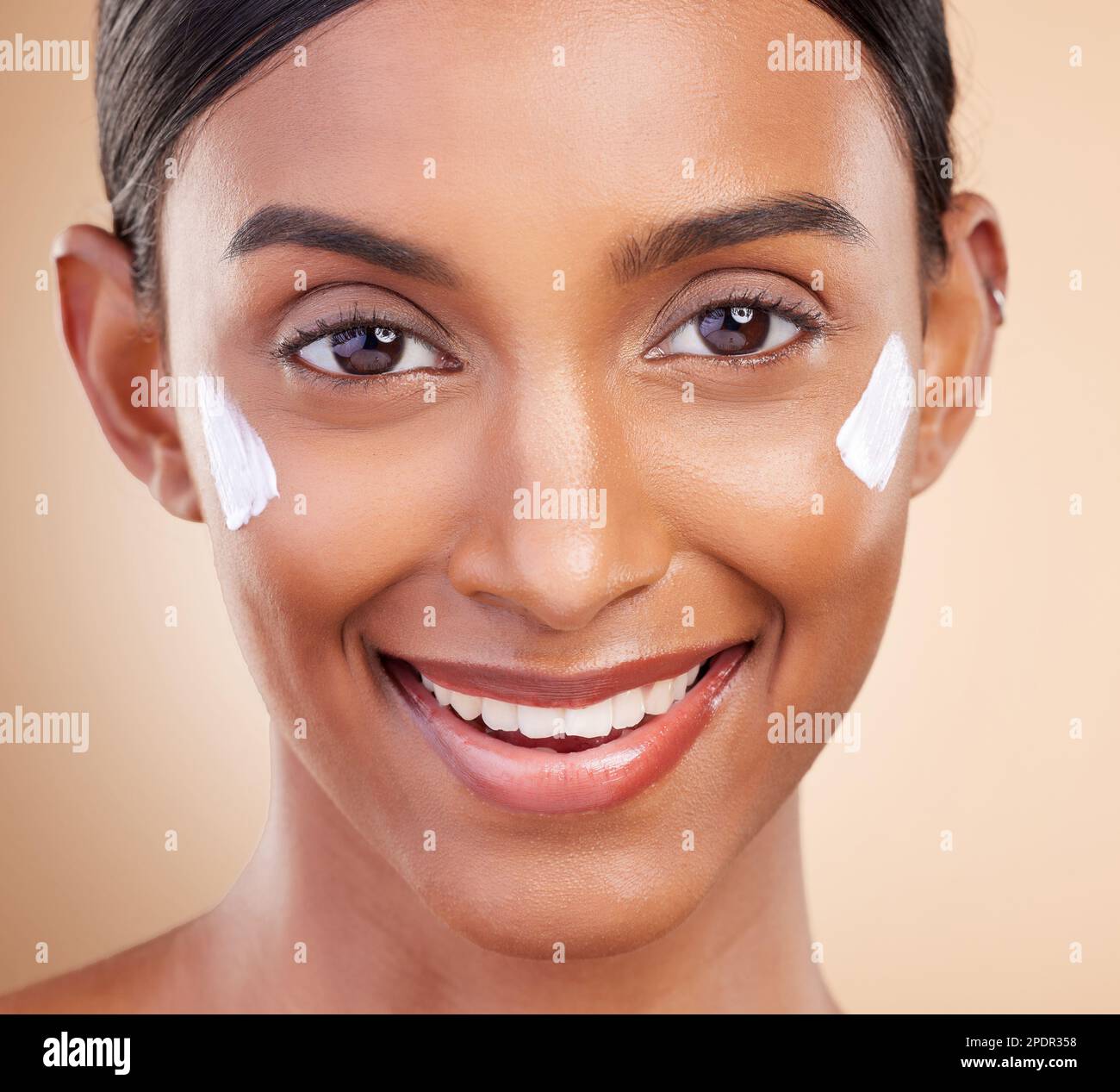 Portrait, face and cream with a model woman in studio on a beige ...