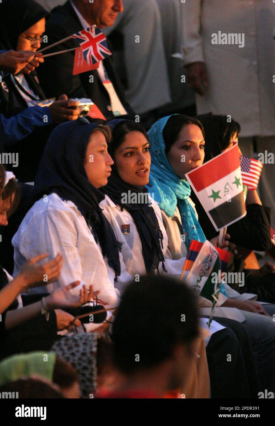 American-Pakistani athlete Sarah Kureshi,26, center, holds U.S and ...