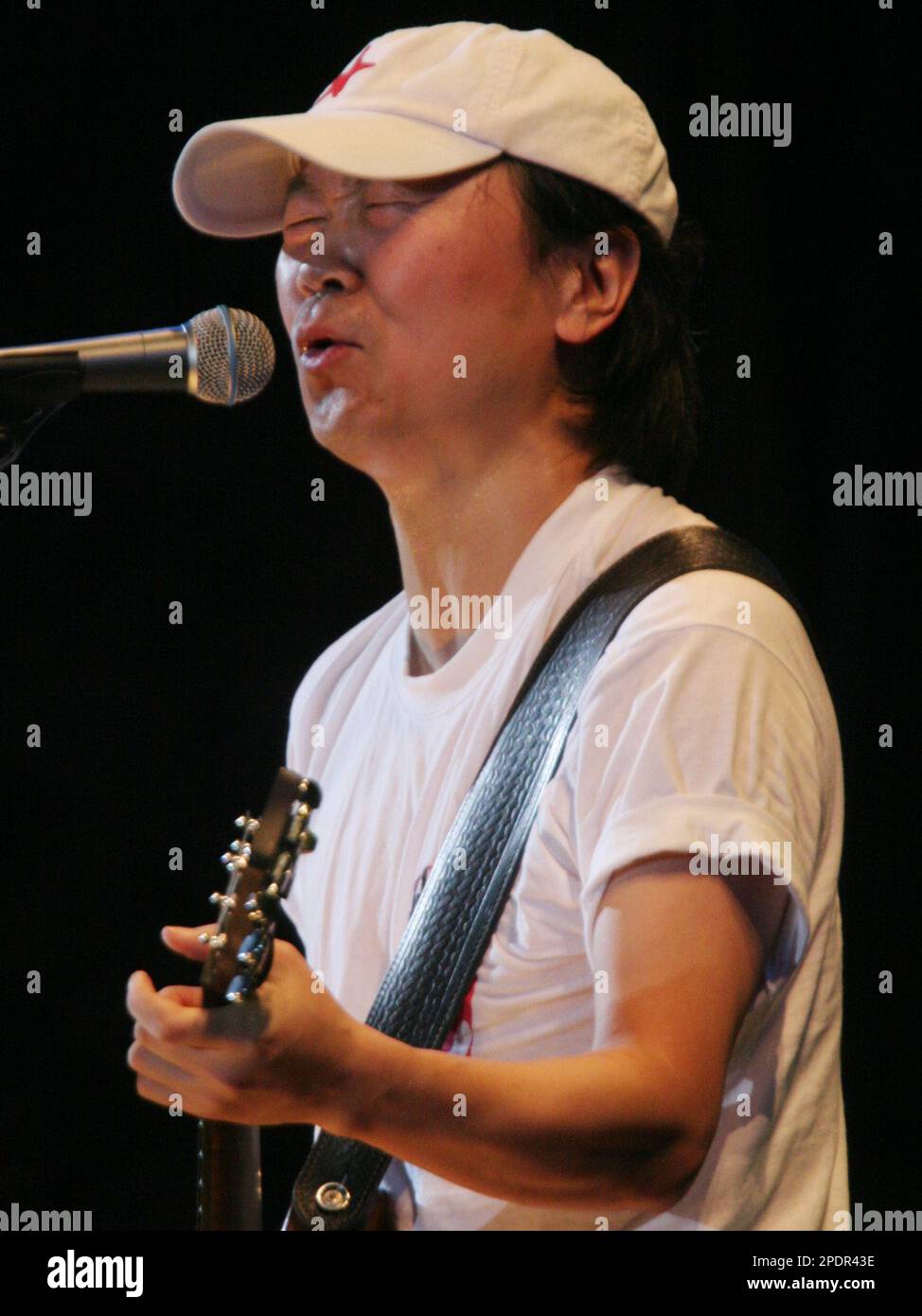 Chinese rock singer Cui Jian performs at Beijing's Capital Stadium ...