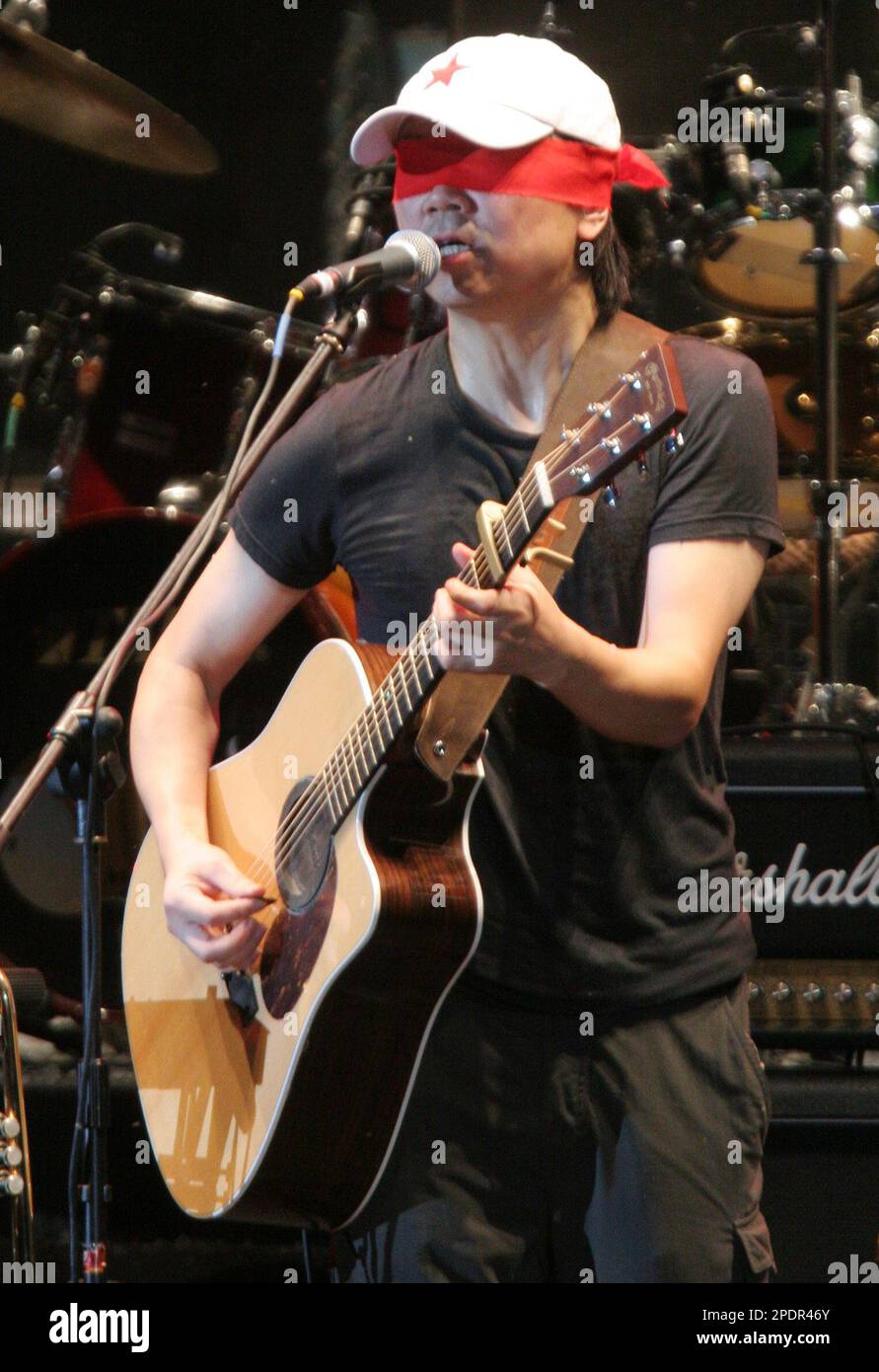 Chinese rock singer Cui Jian performs at Beijing's Capital Stadium ...