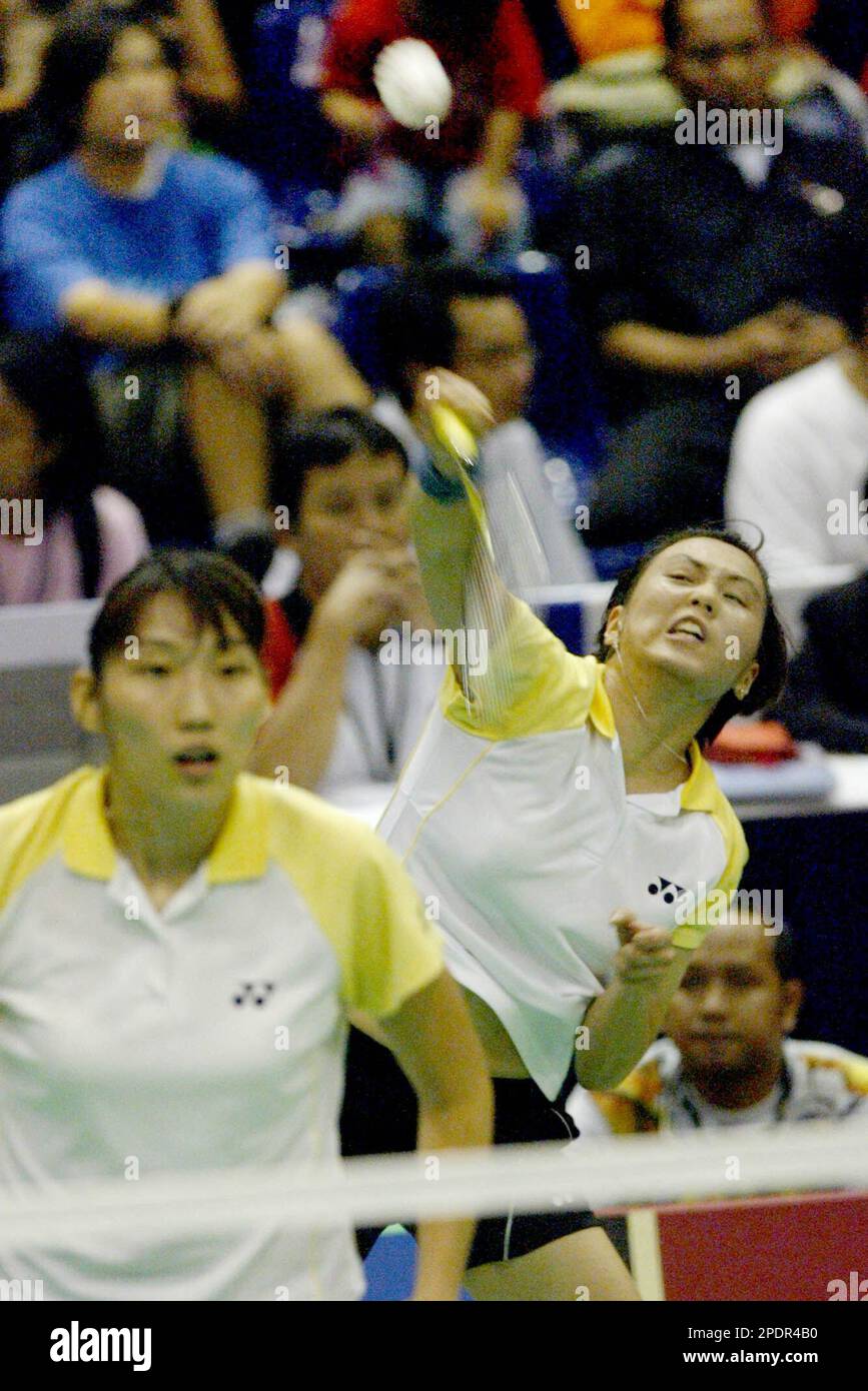 South Korea's Lee Kyung Won, right, smashes against Singapore's Jiang ...