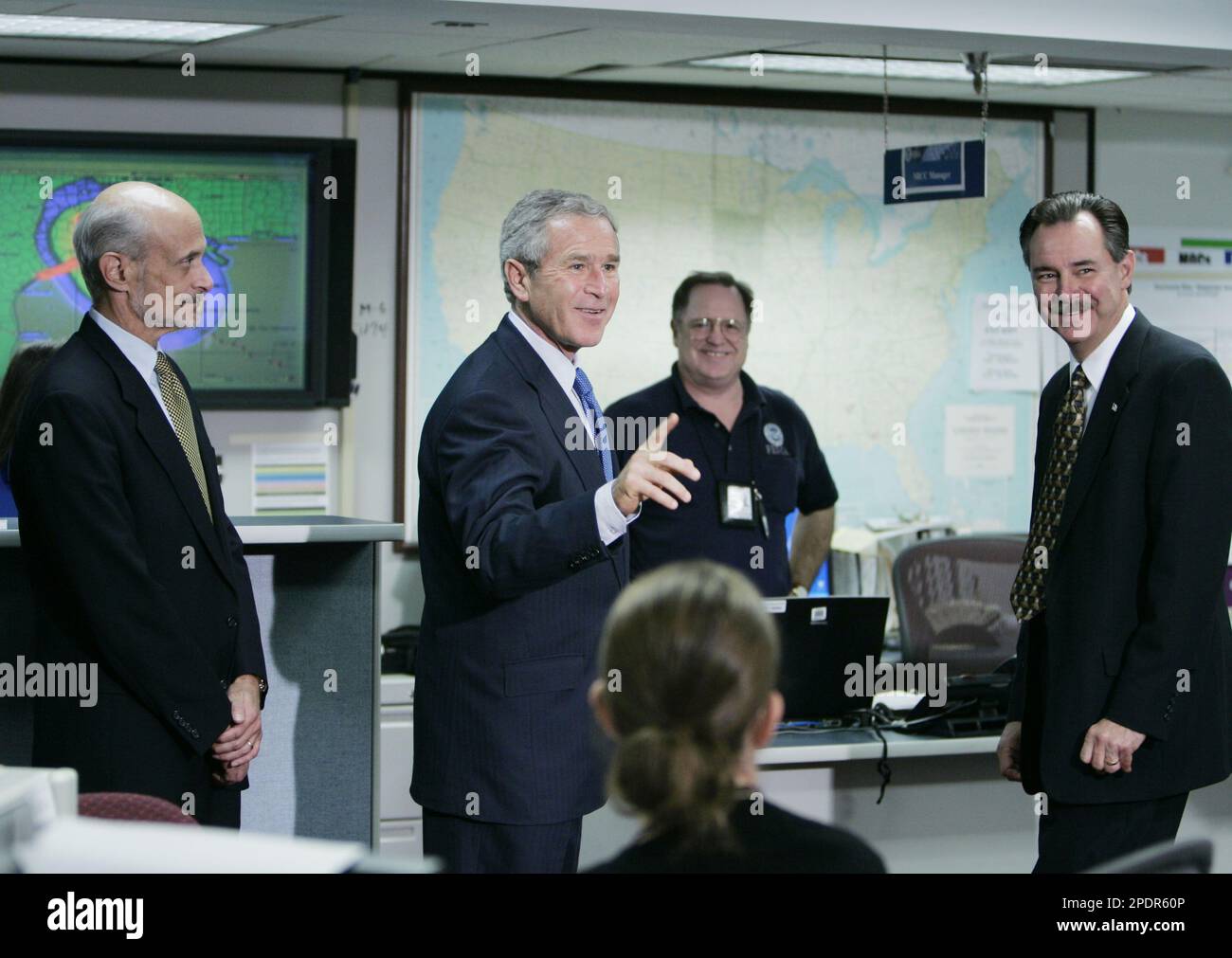 President Bush answers a reporter's question as he attends a briefing ...