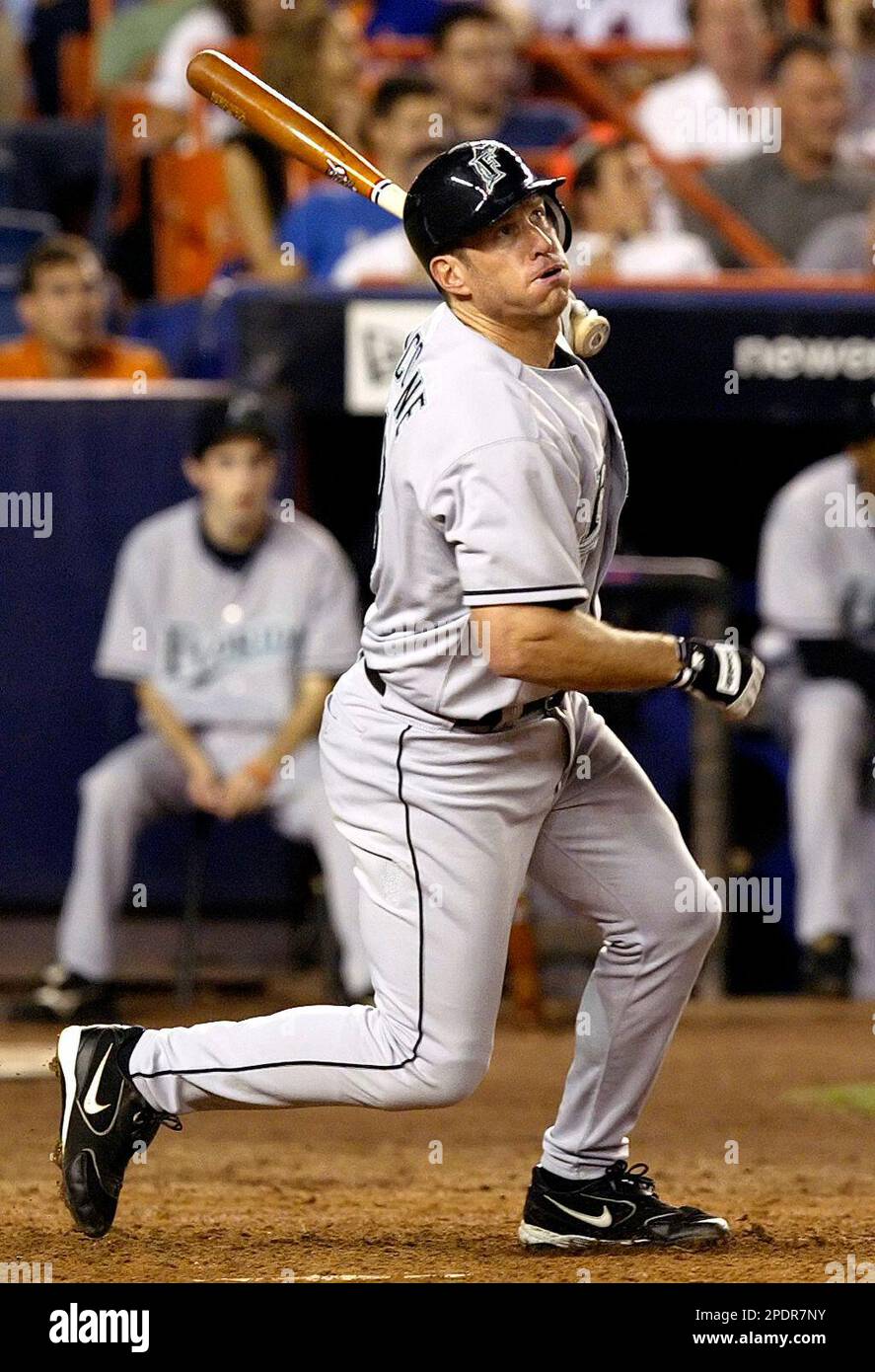 The Florida Marlins' Jeff Conine watches his hit for a triple against ...