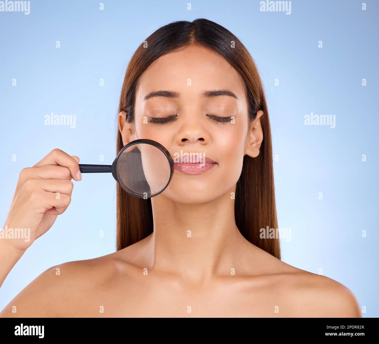 Magnifying glass, woman and face in studio for skincare analysis ...