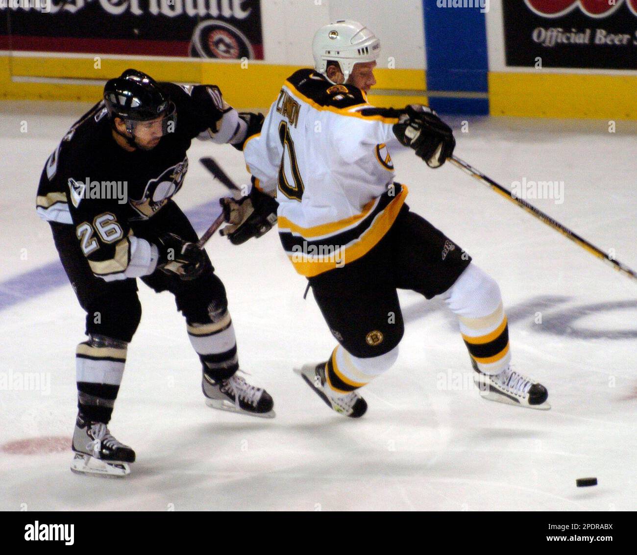 Pittsburgh Penguins' Maxime Talbot (26) pulls Boston Bruins' Alexei ...