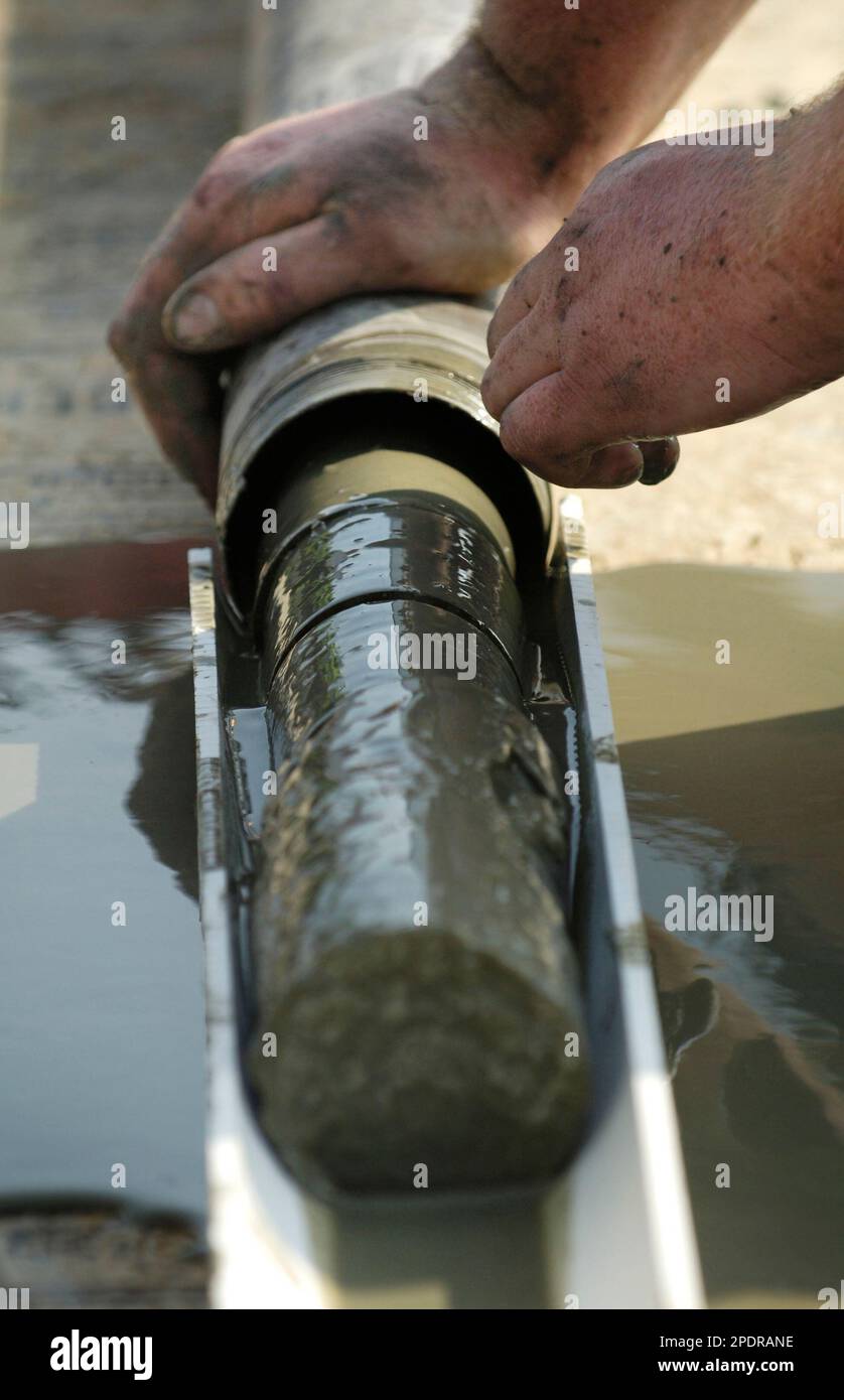 Hard clay and silt core sample is recovered from a core casing taken ...