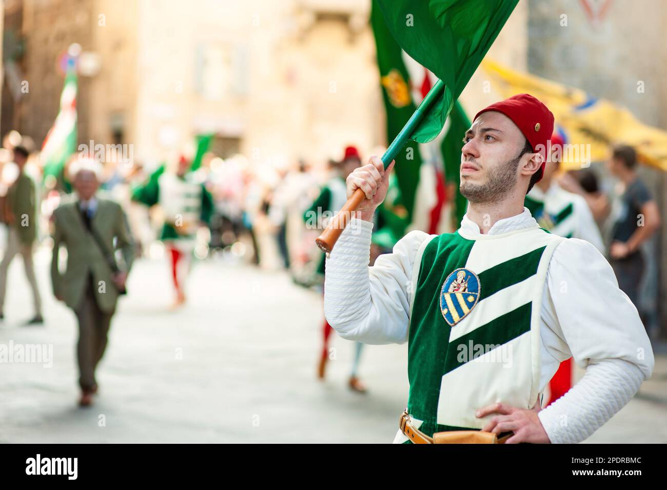 SIENA, ITALY - JULY 2013: Members of the noble Contrada dell'Oca ...