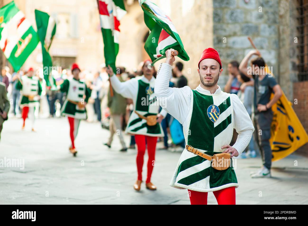 SIENA, ITALY - JULY 2013: Members of the noble Contrada dell'Oca ...