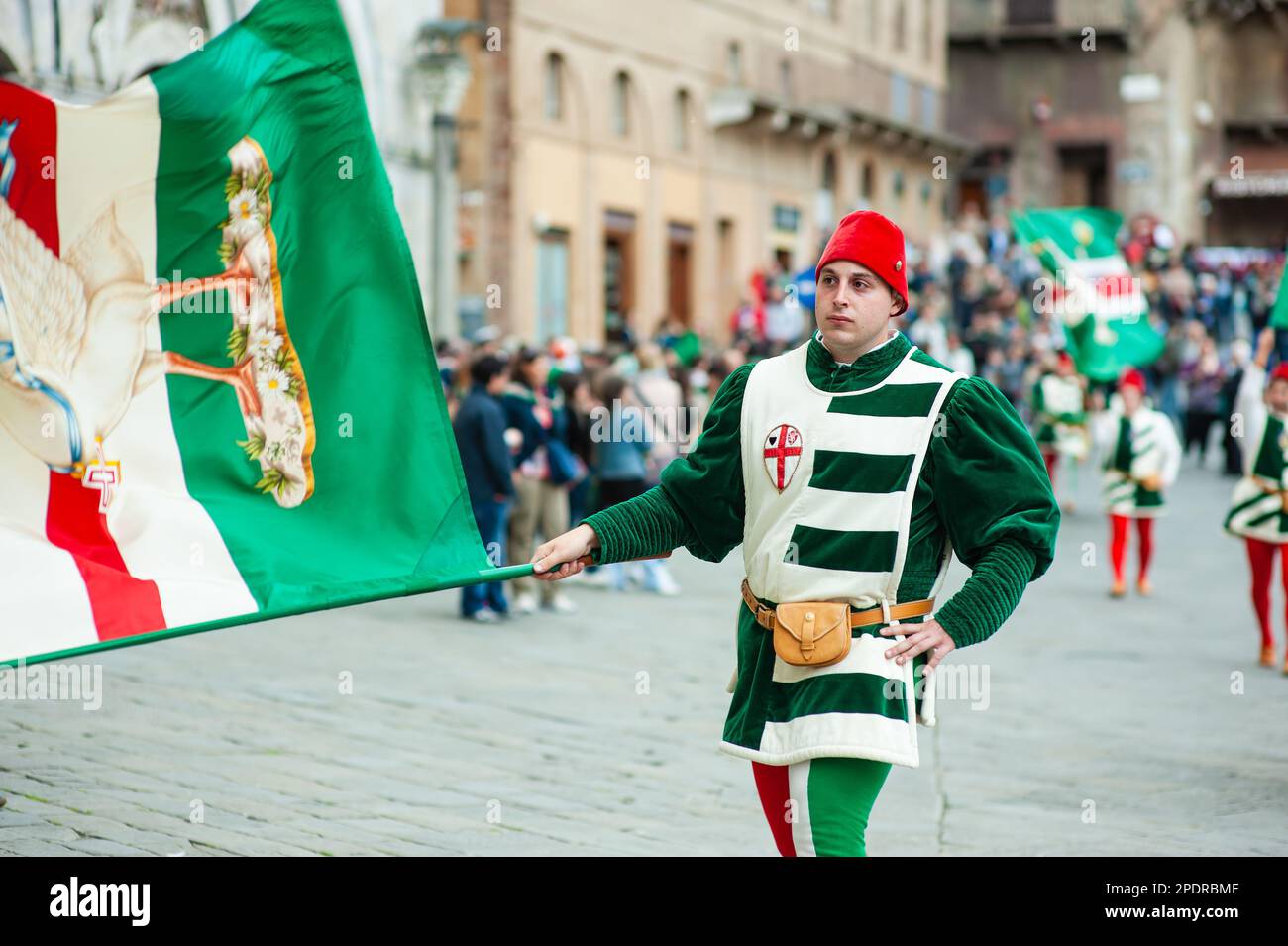 SIENA, ITALY - JULY 2013: Members of the noble Contrada dell'Oca ...