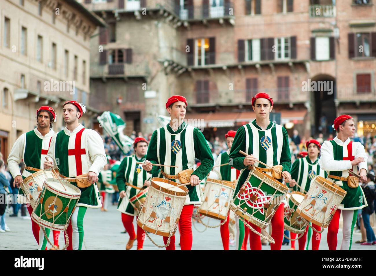 SIENA, ITALY - JULY 2013: Members of the noble Contrada dell'Oca ...