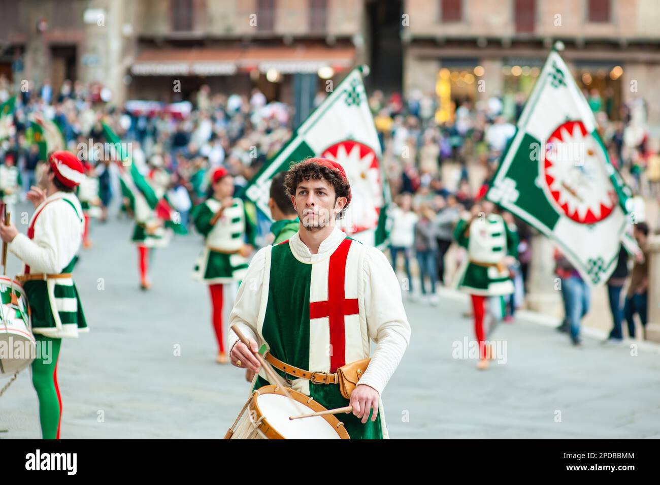 SIENA, ITALY - JULY 2013: Members of the noble Contrada dell'Oca ...