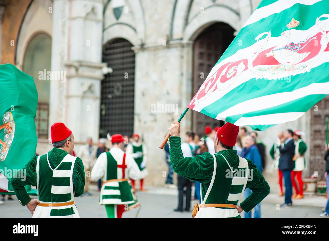 SIENA, ITALY - JULY 2013: Members of the noble Contrada dell'Oca ...