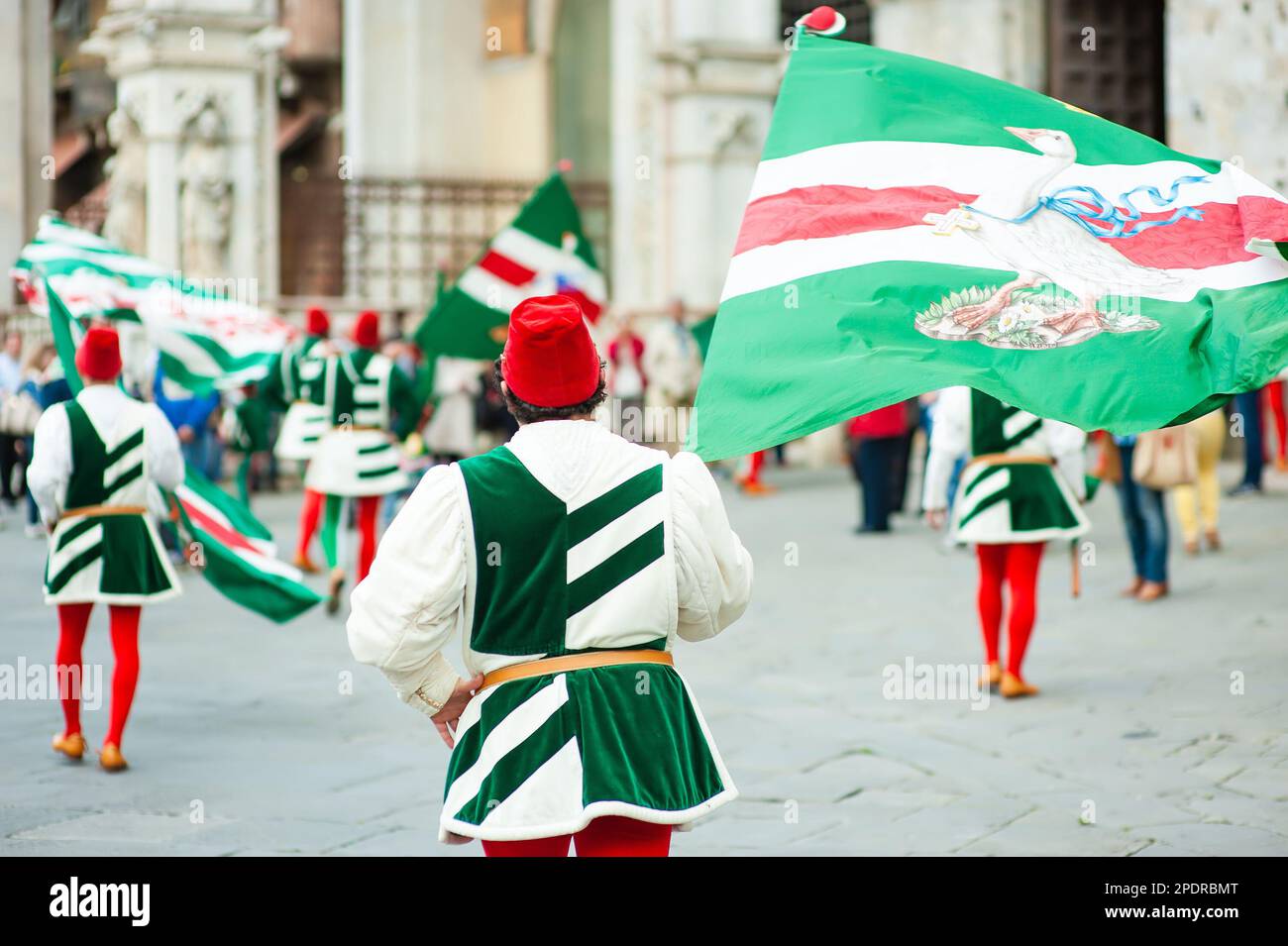 SIENA, ITALY - JULY 2013: Members of the noble Contrada dell'Oca ...