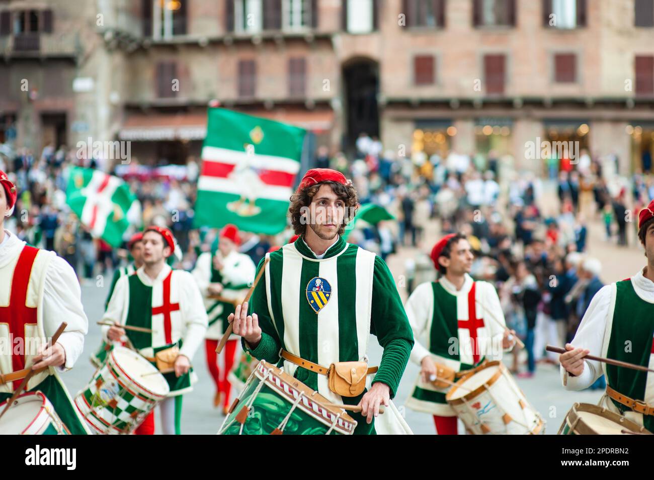 SIENA, ITALY - JULY 2013: Members of the noble Contrada dell'Oca ...