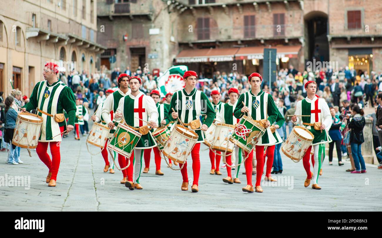 SIENA, ITALY - JULY 2013: Members of the noble Contrada dell'Oca ...