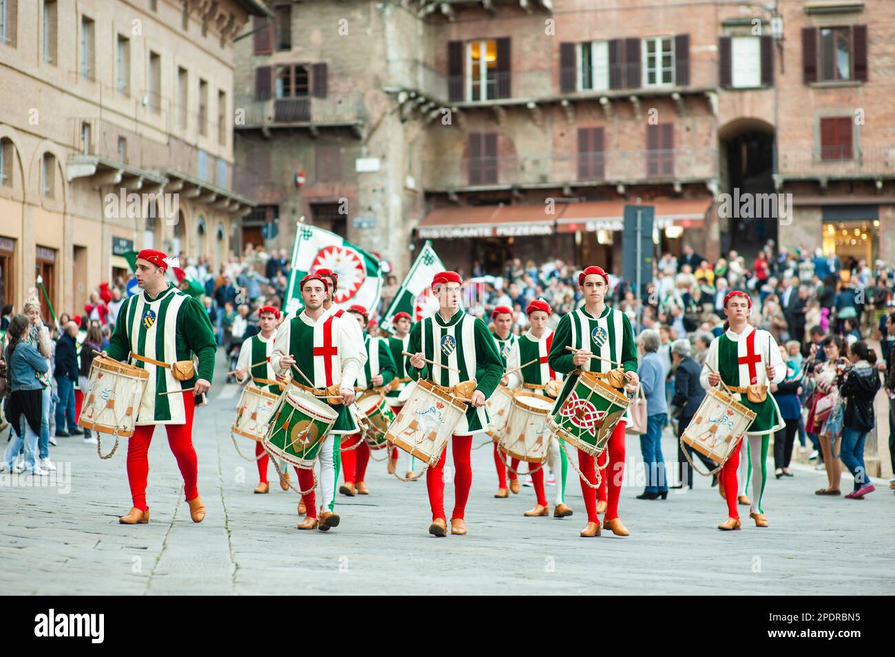 SIENA, ITALY - JULY 2013: Members of the noble Contrada dell'Oca ...