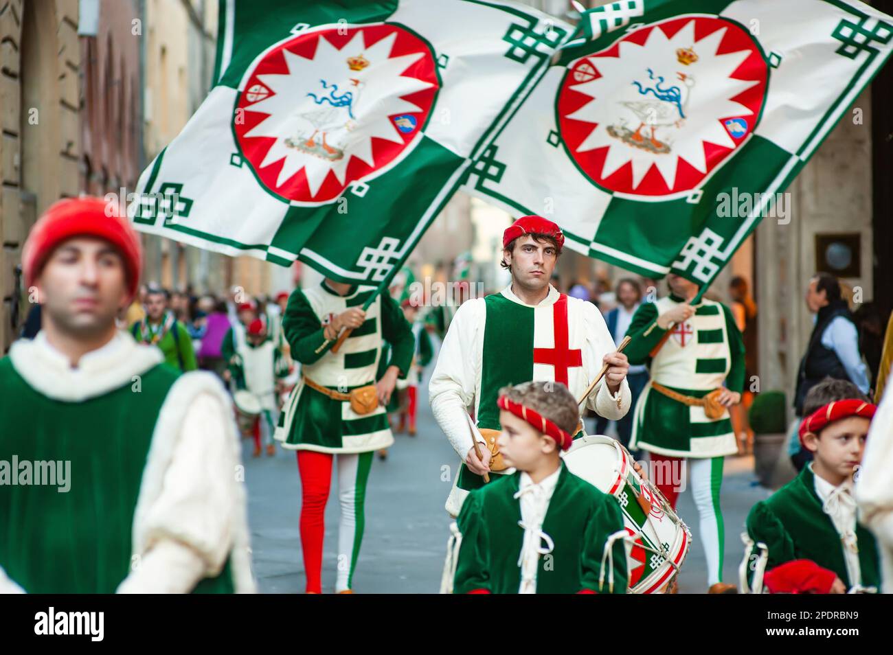 SIENA, ITALY - JULY 2013: Members of the noble Contrada dell'Oca ...