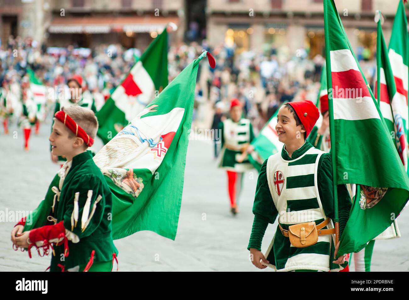 SIENA, ITALY - JULY 2013: Members of the noble Contrada dell'Oca ...