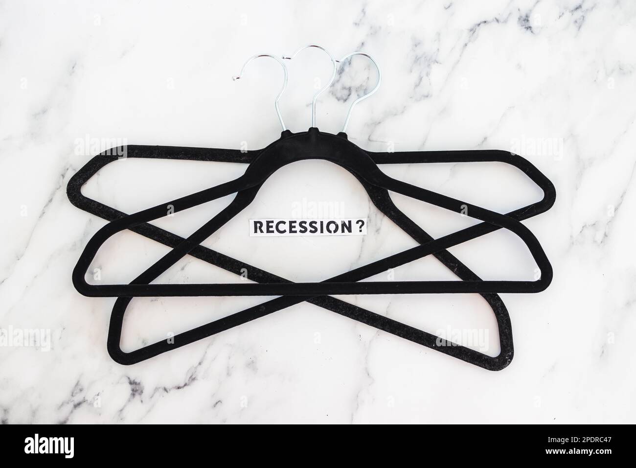 shopping and purchasing power in the post pandemic economy, group of clothes hangers with ...