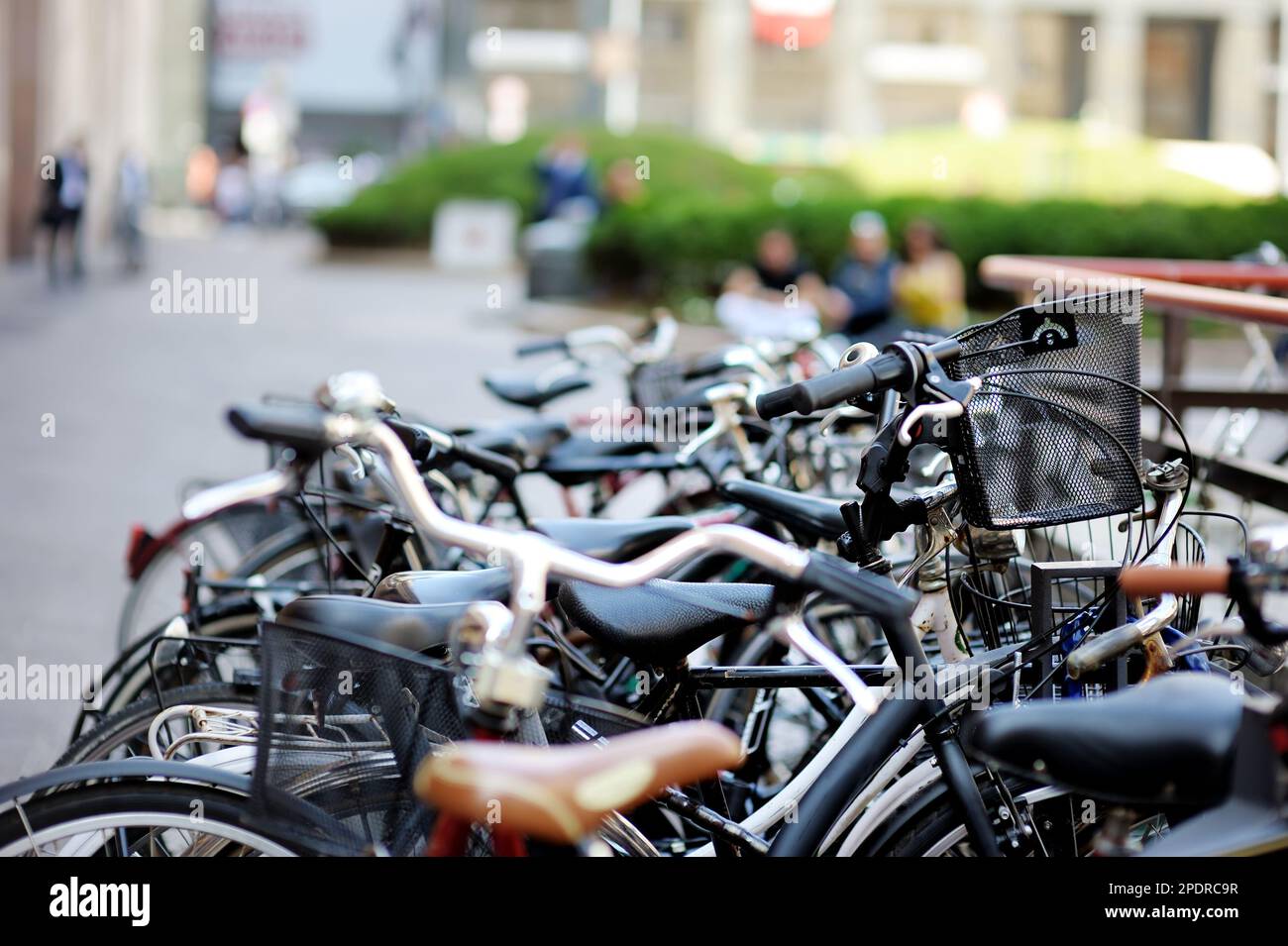 Many bicycles parked on the street of Milan. Exploring a city center ...