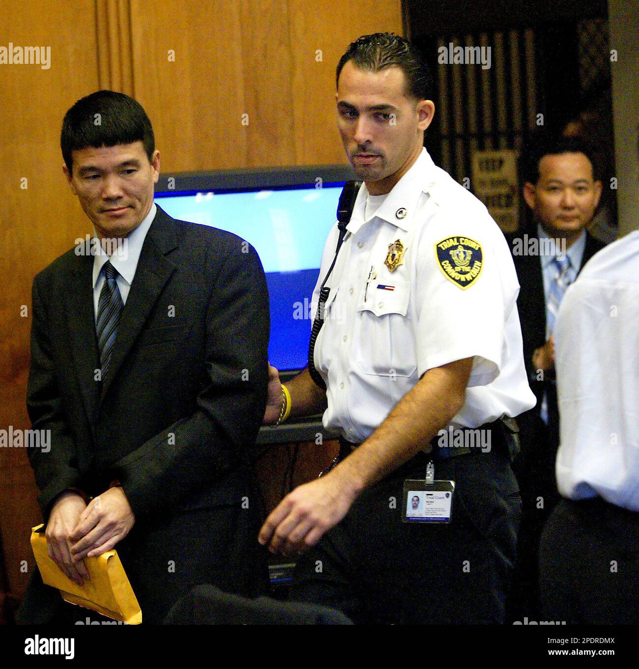 Siny Van Tran, left, and Nam The Tham, far right, enter a Suffolk ...