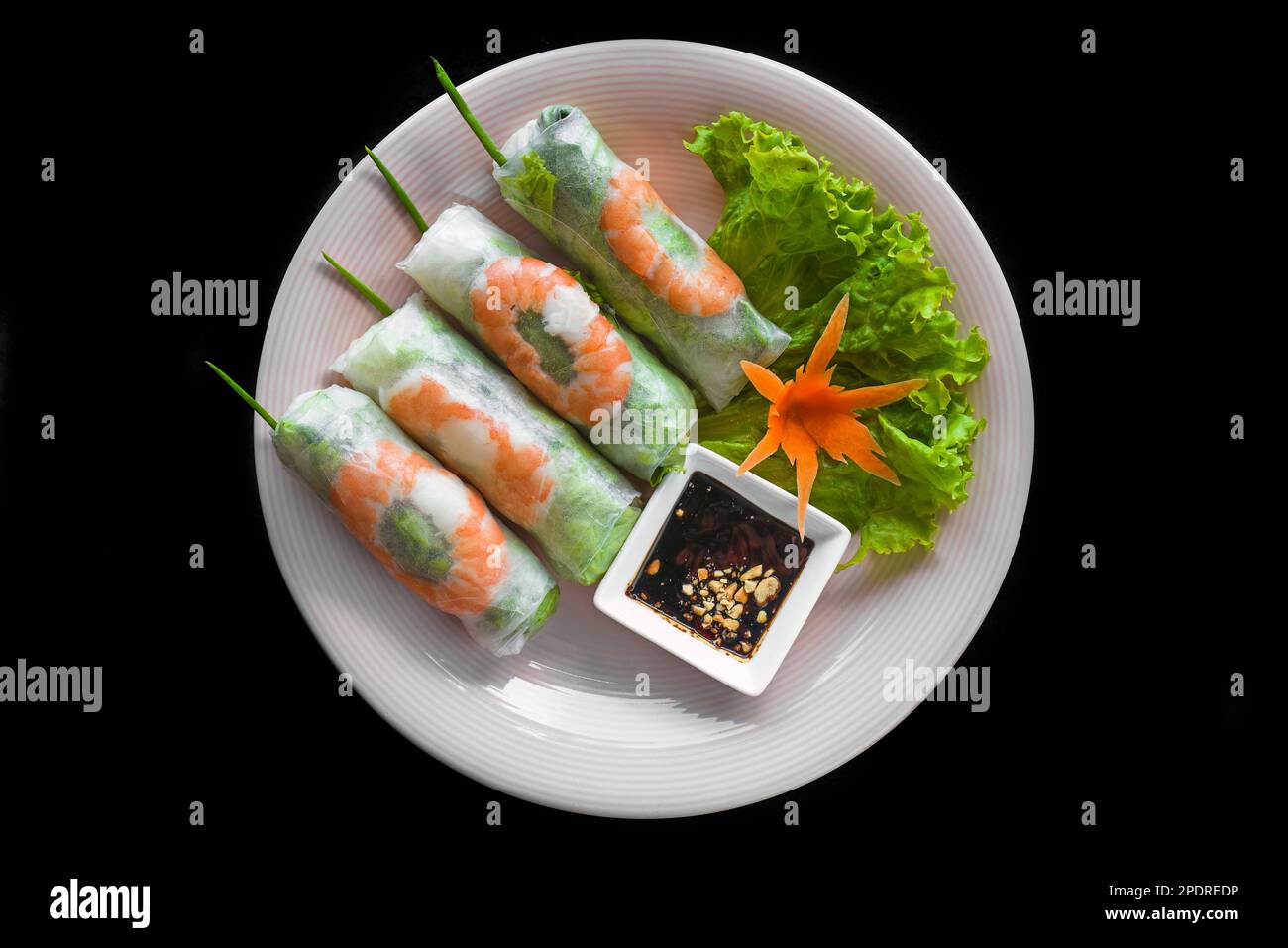 Traditional vietnamese spring rolls with shrimps, rice paper on black ...