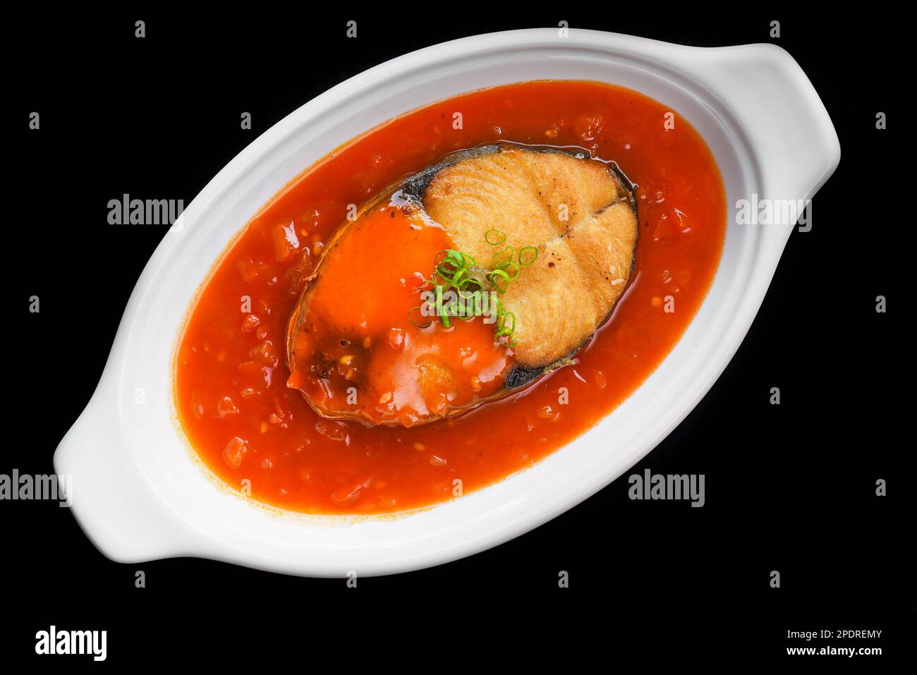 Vietnamese stewed sapa fish in red sauce isolated on black bacground ...