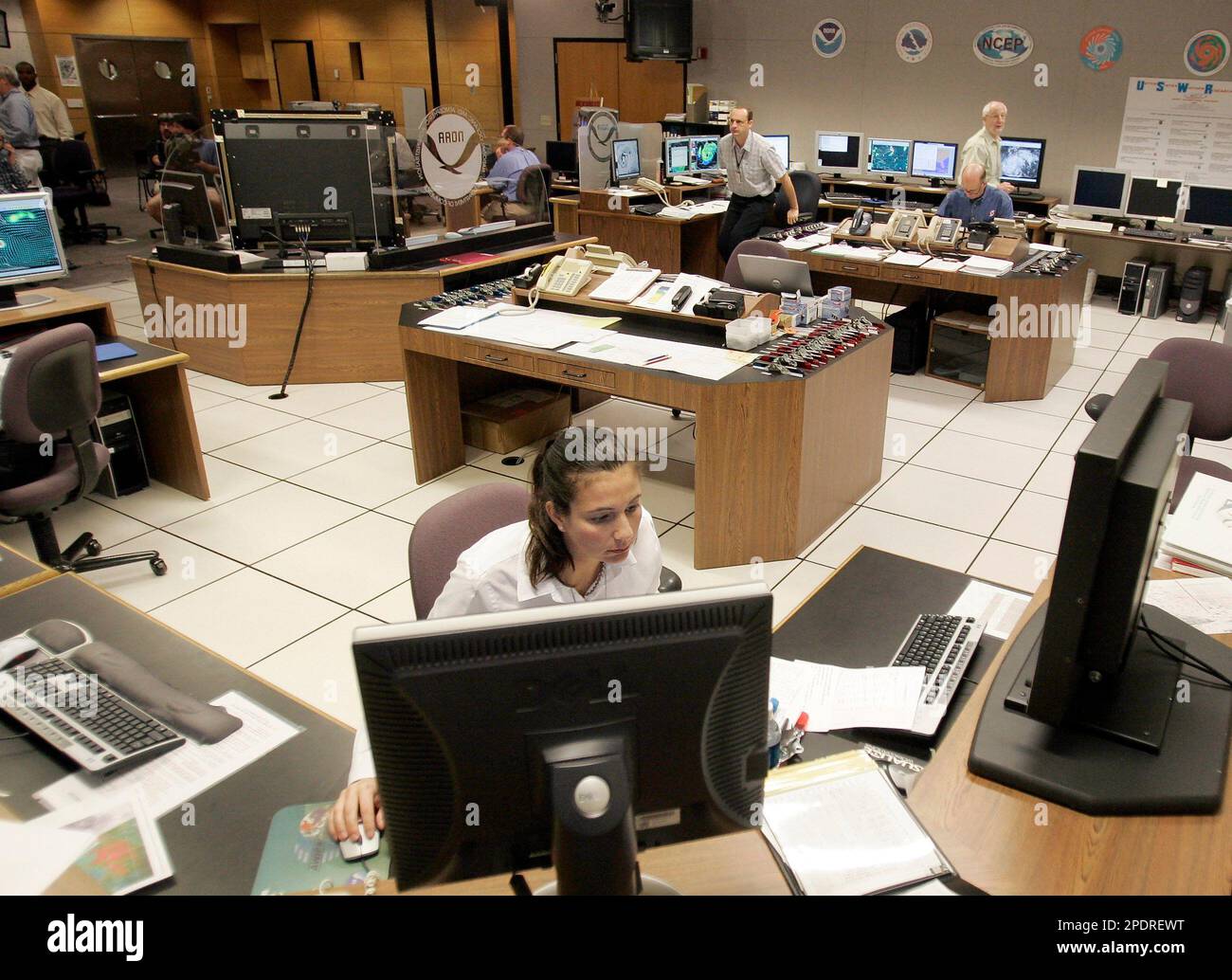 Meteorologist Michelle Mainelli, foreground, keeps track of Hurricane ...