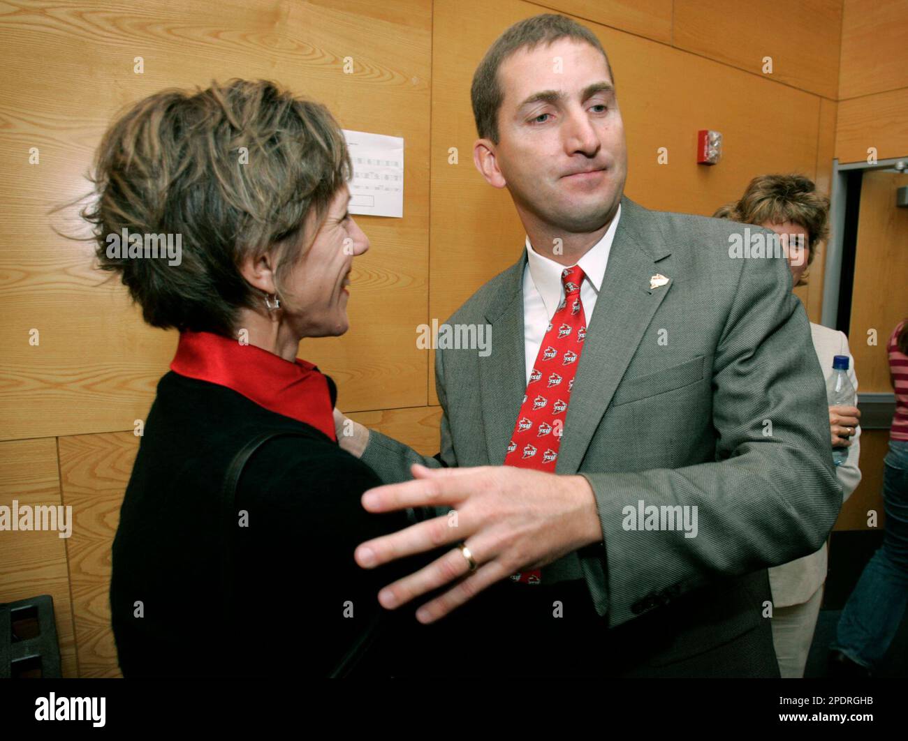 Jamie Pollard, right, is greeted by his wife Ellen, left, after being ...