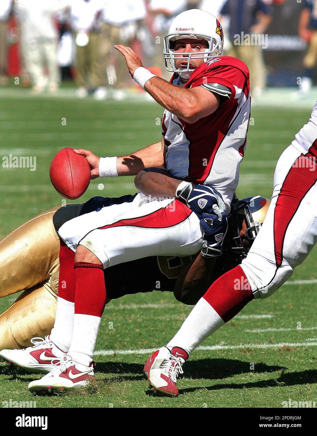 St. Louis Rams' Jimmy Kennedy sacks Arizona Cardinals quarterback Kurt ...