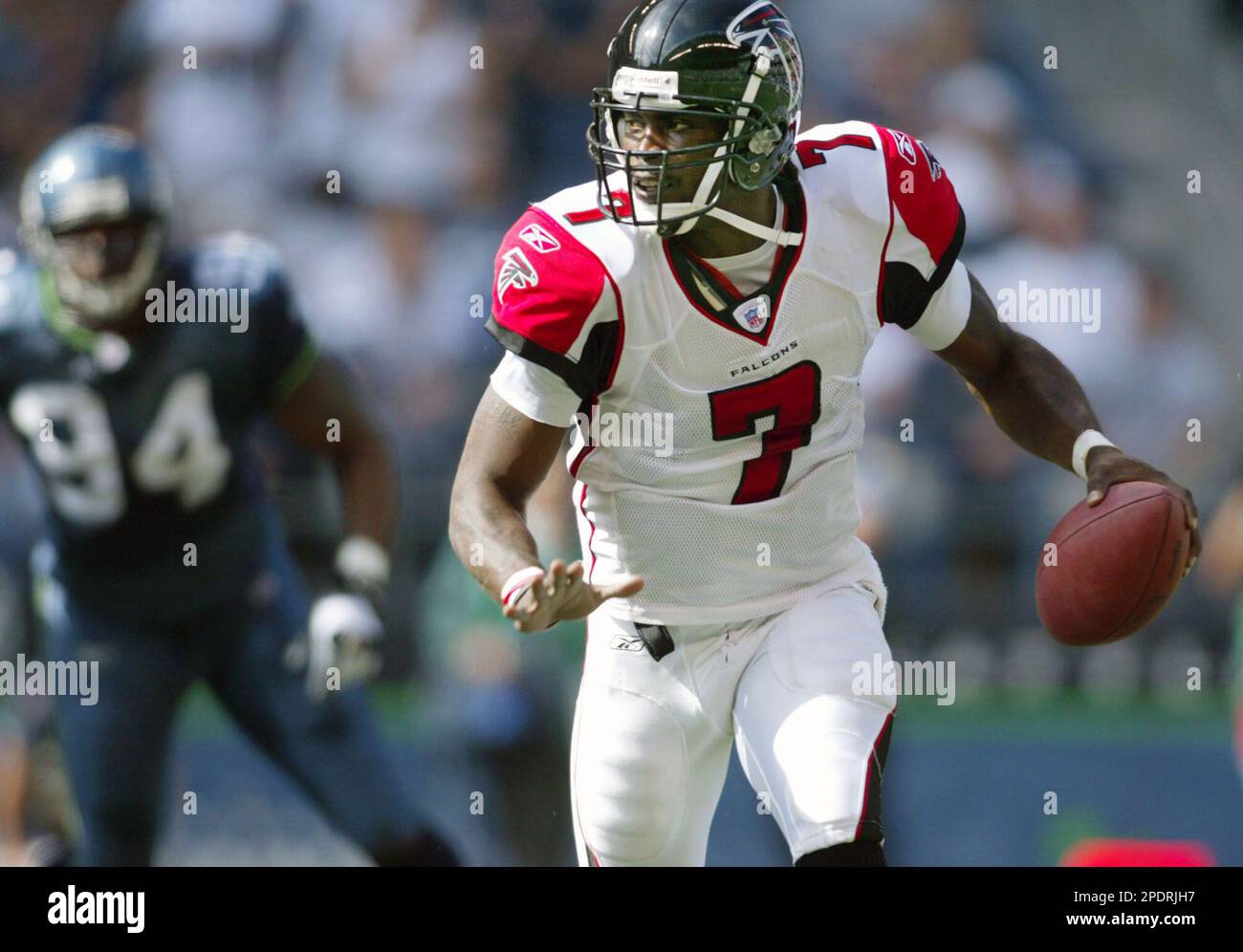 Atlanta Falcons quarterback Michael Vick looks for a receiver while ...
