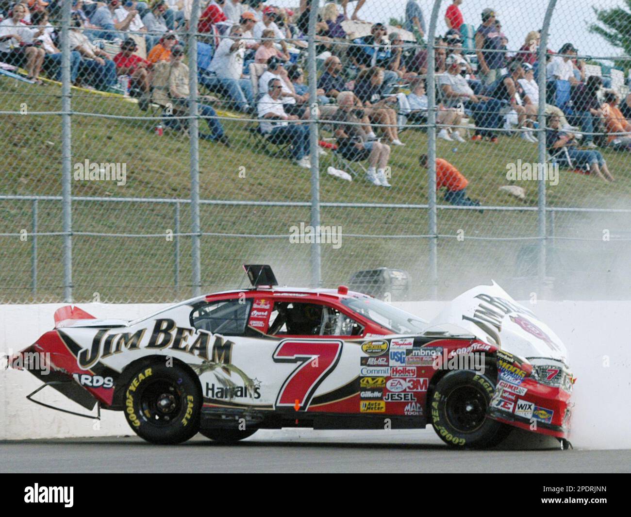 Robby Gordon bounces off the wall during the NASCAR Sylvania 300 on ...
