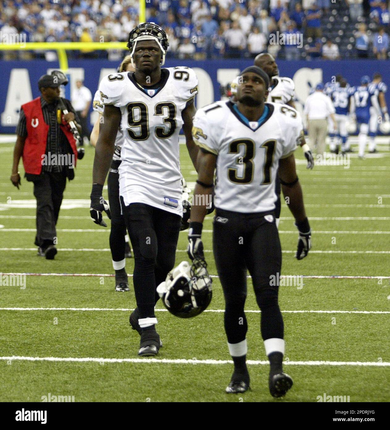 Jacksonville Jaguars' Bobby McCray (93) and Scott Starks (31) leave the ...