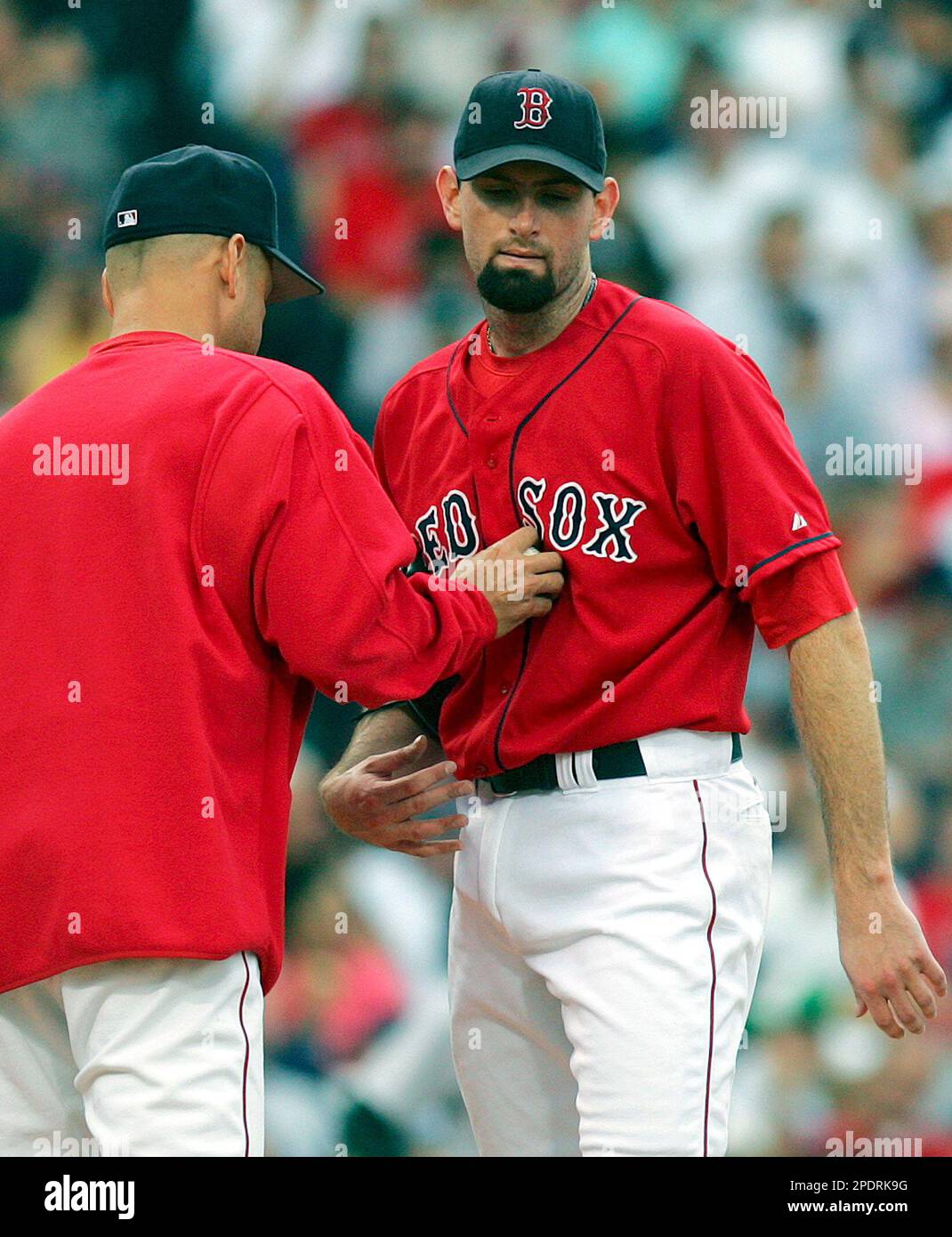 Boston Red Sox Manager Terry Francona, left, takes the ball from Matt ...