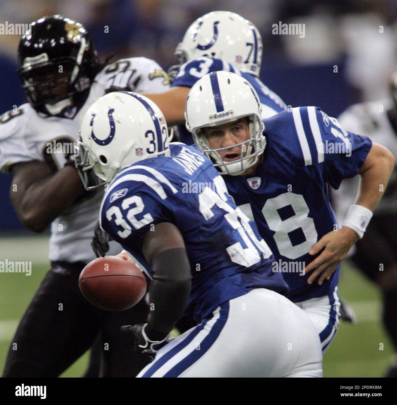 Indianapolis Colts quarterback Peyton Manning, right, hands off to ...