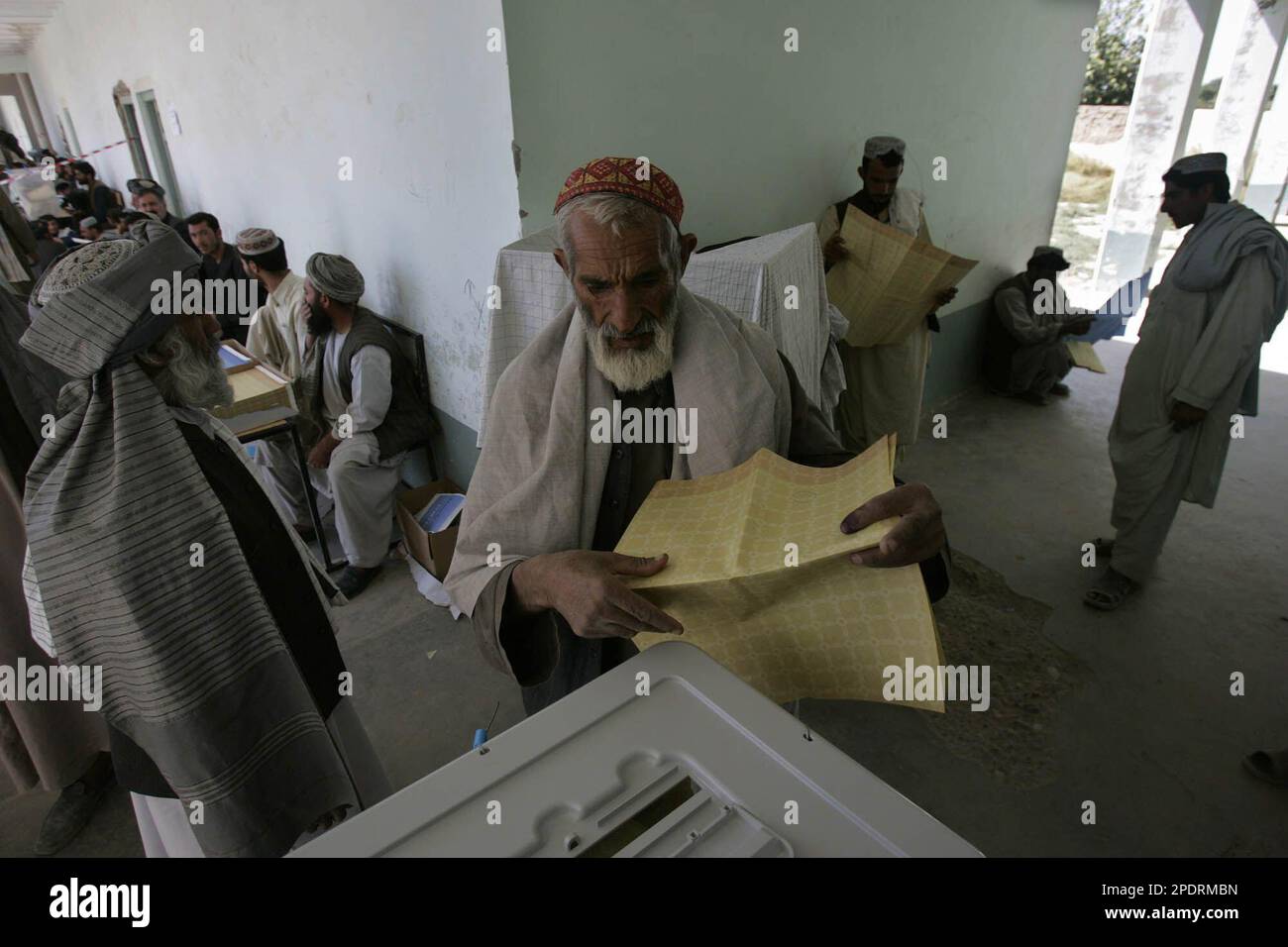 A man approaches a ballot box to cast his vote in Kandahar, Afghanistan ...