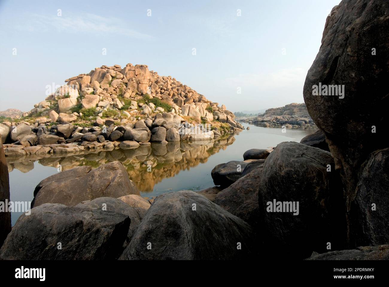 River Tugabhadra and beautiful hill of boulders in morning lightat at Hmpi state Karnataka India ...