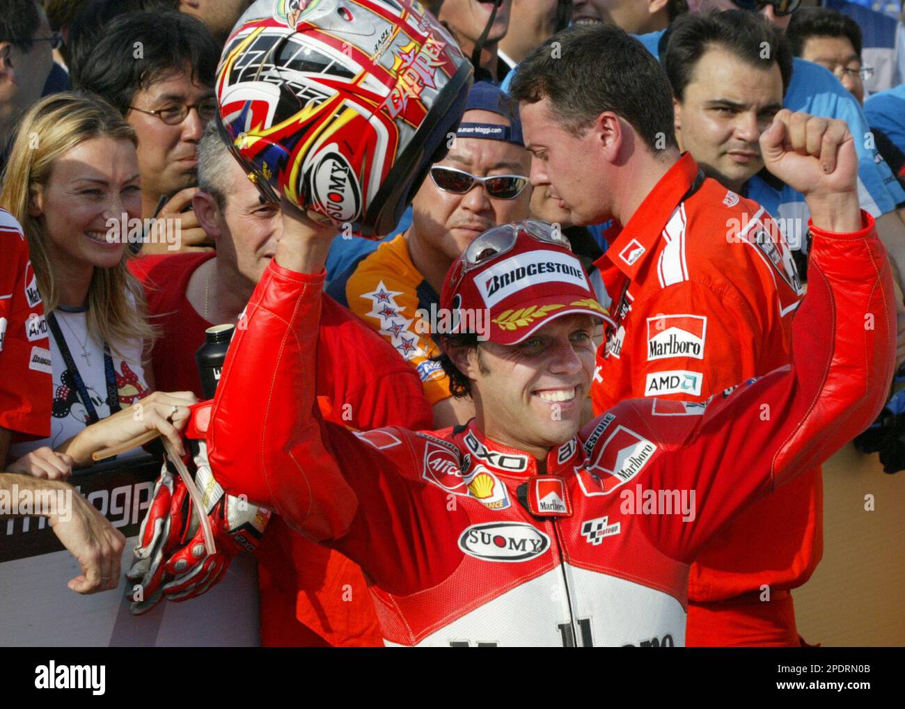The winner of MotoGP race, Loris Capirossi of Italy celebrates with his ...
