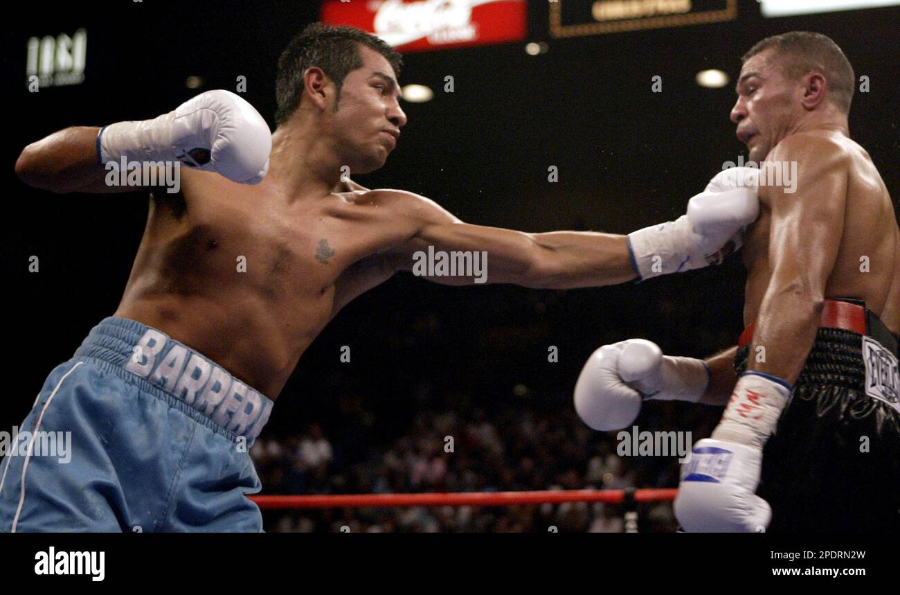 Robbie Peden, right, of Brisbane, Australia, takes a punch from Marco ...