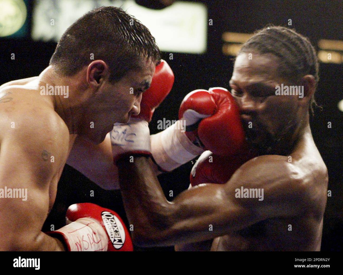 Jesus Chavez, left, punches Leavander Johnson during their IBF ...